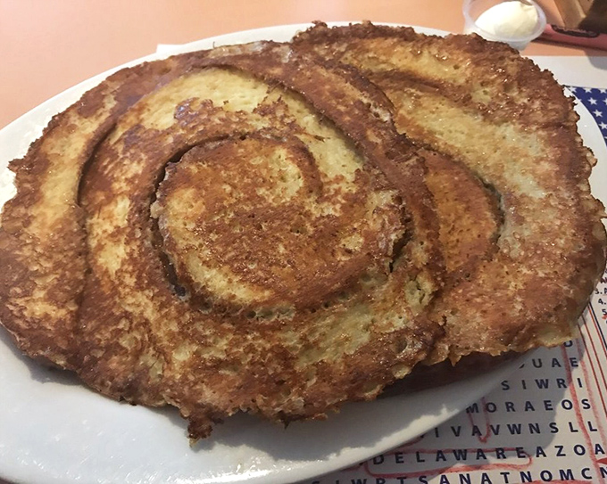 The honey bun pancake – a swirled masterpiece that combines cinnamon roll vibes with pancake fluffiness for an unforgettable breakfast experience.