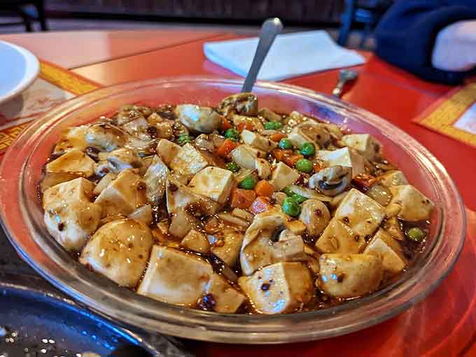 Tofu prepared with care and respect, swimming in flavorful sauce that converts even the skeptics into believers one bite at a time.