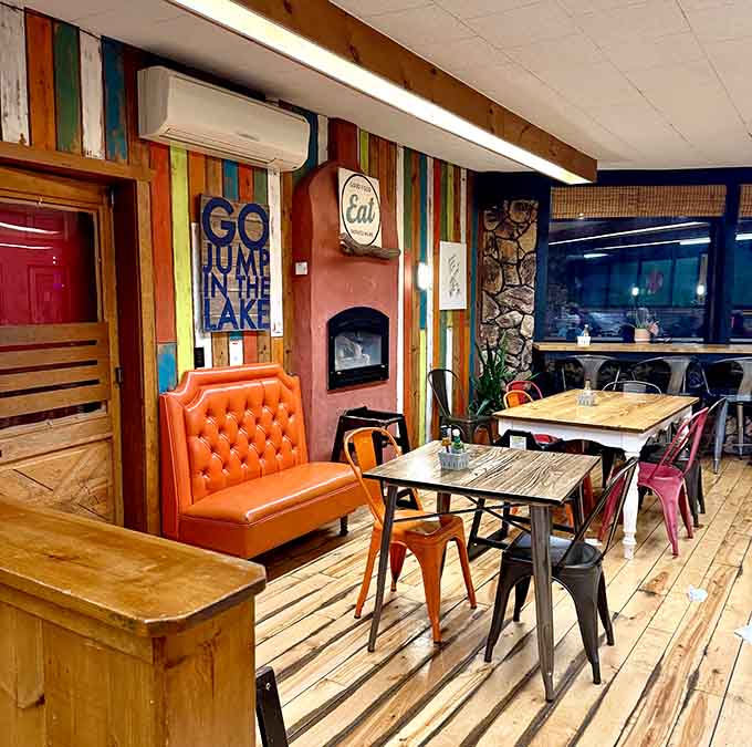 Mismatched chairs and wooden tables create a casual dining space where the focus is squarely on the food and good company.