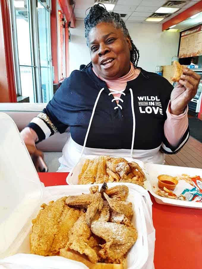 Pure joy captured in a single moment, because that's what really good fried fish does to people regardless of age or background.