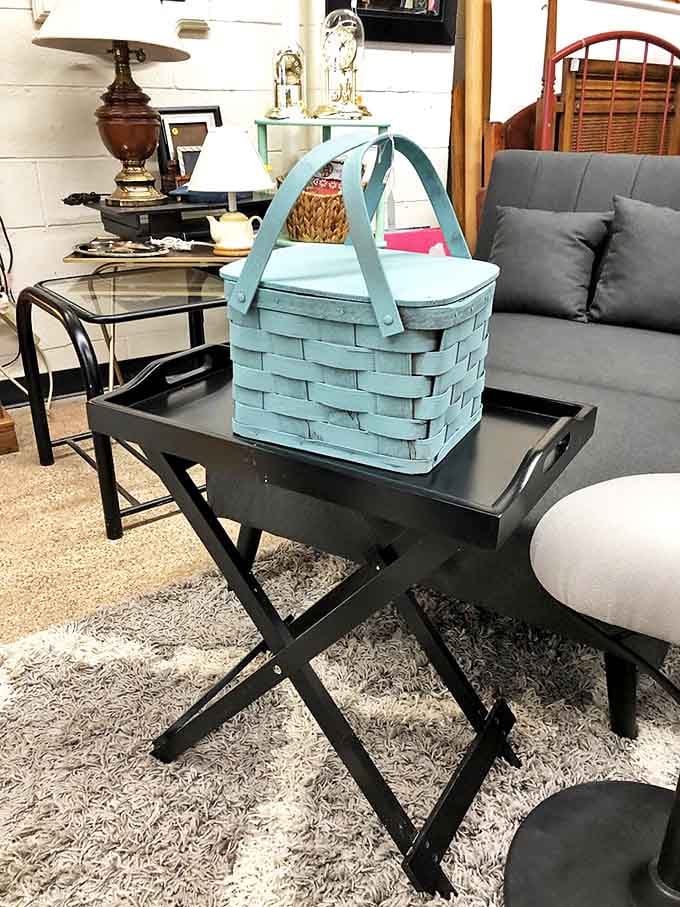 That turquoise basket isn't just storage, it's a statement piece that says you appreciate both function and vintage charm in equal measure.