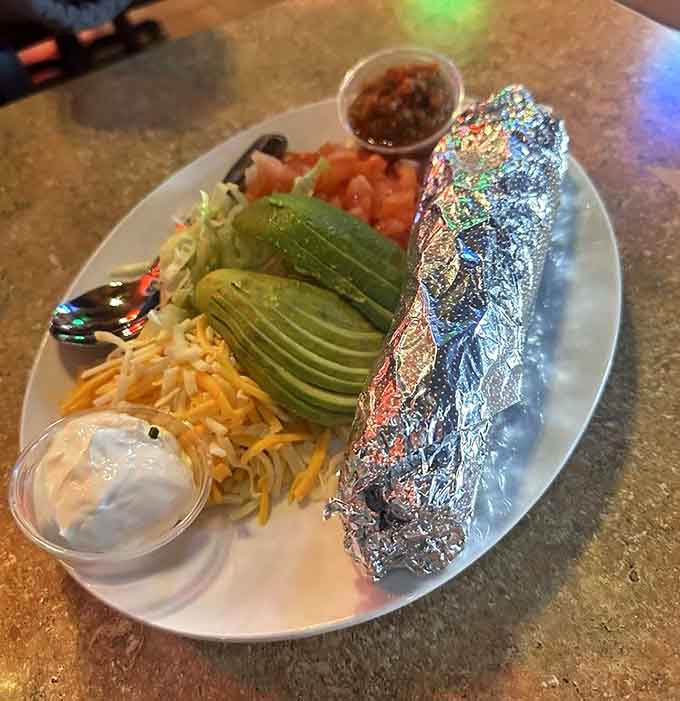 Sizzling steak fajitas arrive wrapped in foil like a delicious present, ready to be assembled with all the fixings your heart desires.