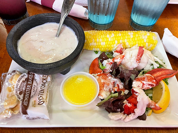 Ocean treasures arranged like edible jewelry&mdash;sweet corn, garden greens, and lobster meat creating a plate that's pure Maine magic.