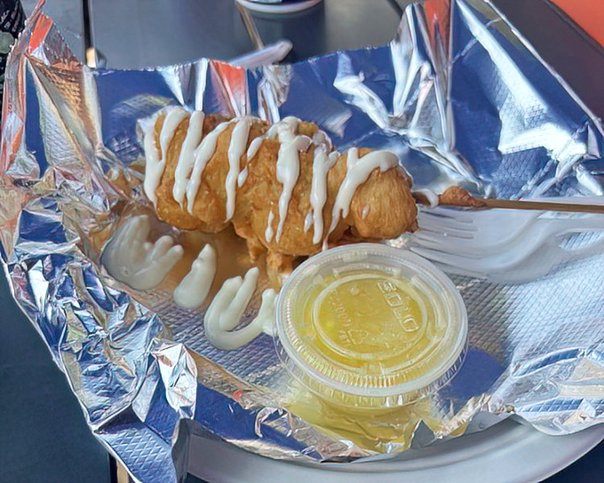 Crispy fried seafood drizzled with tangy sauce &ndash; proof that Red's excellence extends beyond just their famous lobster rolls to everything that swims.