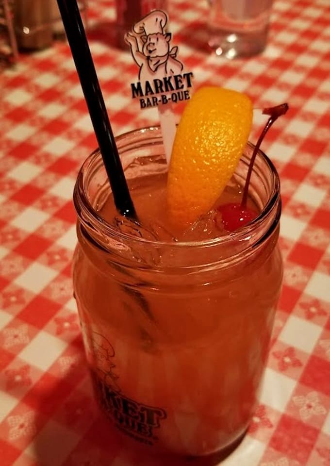 Mason jar cocktails add a festive touch to your meal, served with fruit garnishes that make every sip feel like a celebration.