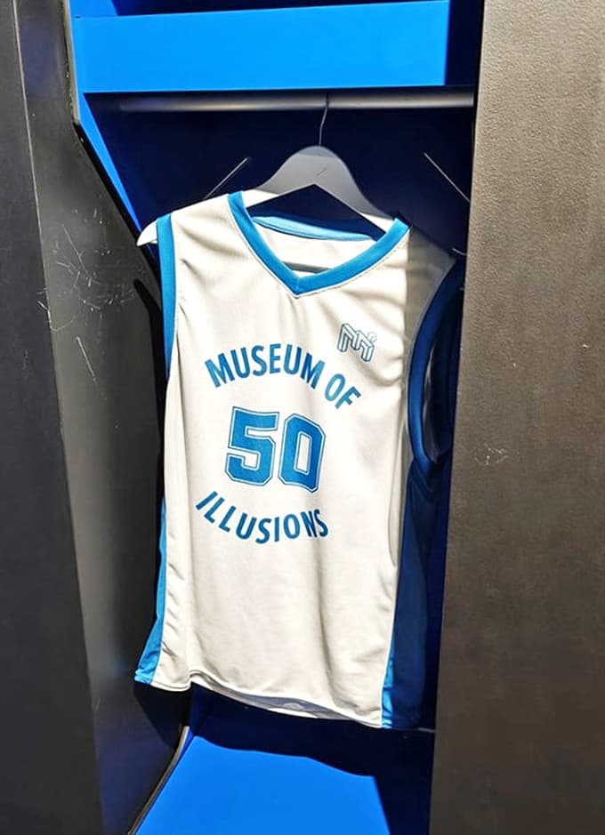 Even the basketball jersey plays with your perception! Sporting the number 50, it's the perfect souvenir for fans of visual trickery.