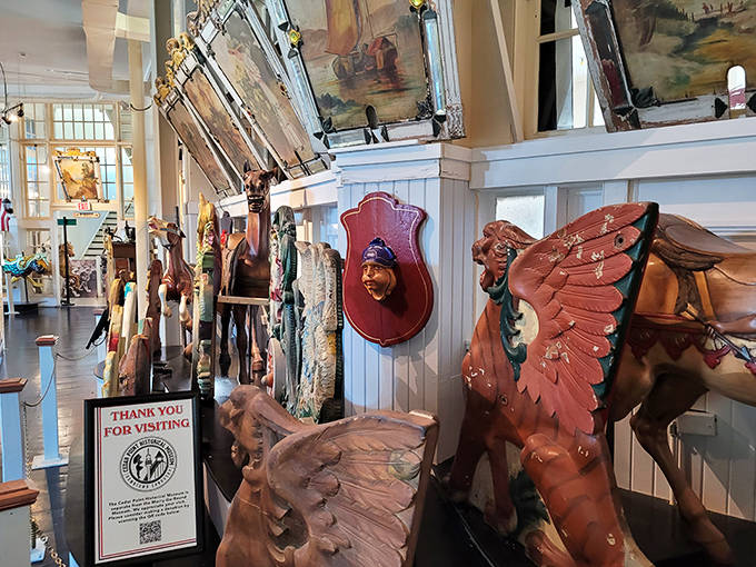 These magnificent carved figures stand frozen mid-gallop, their wooden muscles tensed for a race that's been running for over a century.