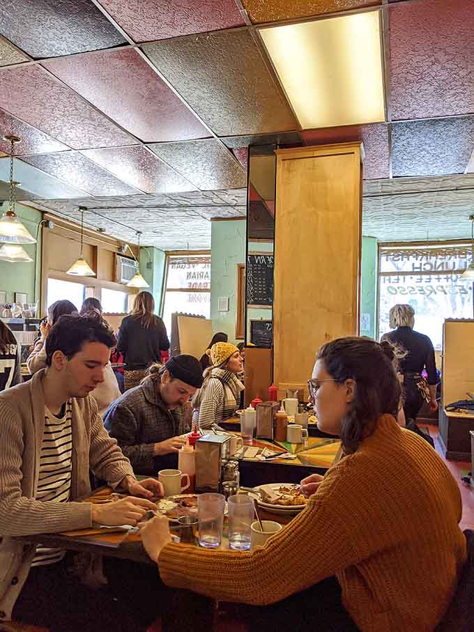 The diverse crowd of diners reflects Minneapolis itself, where everyone's welcome at the breakfast table.