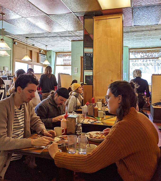 The dining room buzzes with conversation and contentment, where strangers become neighbors over shared appreciation for exceptional food and warm hospitality.