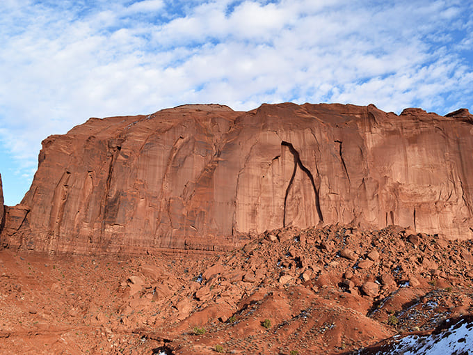 The endless blue sky meets red earth in a horizon line so perfect it looks photoshopped, except it's gloriously real.