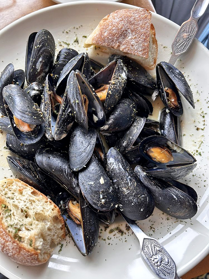 Muscle up for mussels! These plump beauties are having a pool party in a savory broth. Grab some bread and dive in!