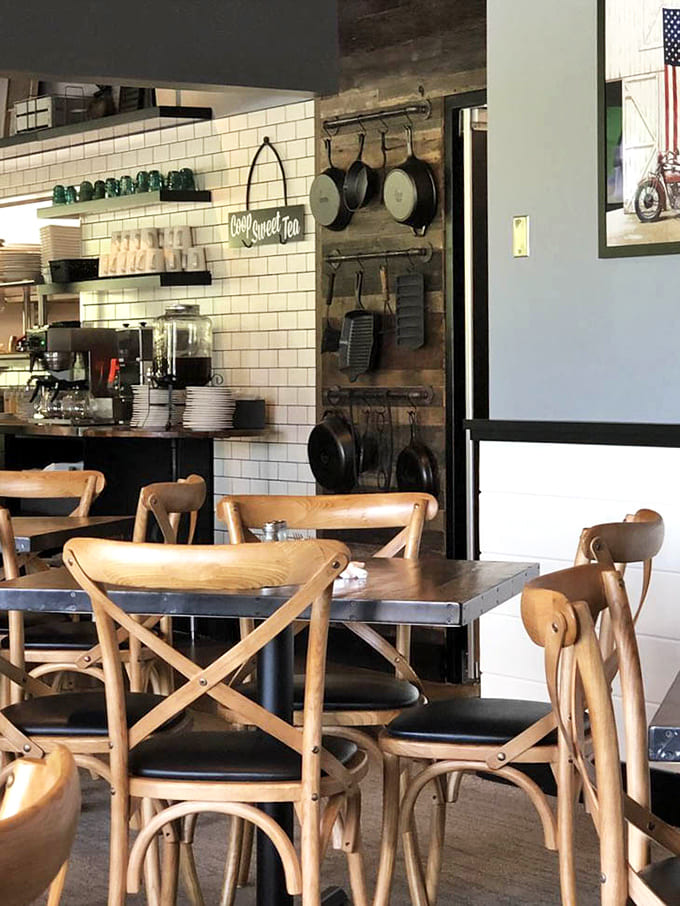 The main dining room balances rustic charm with modern comfort, featuring American flags and twinkling lights overhead for ambiance.