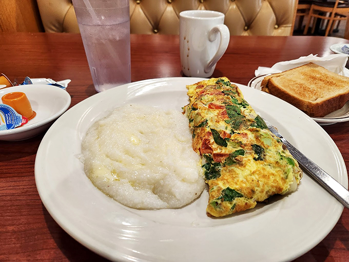 This omelet and grits combo proves that North meets South in the most delicious way possible.