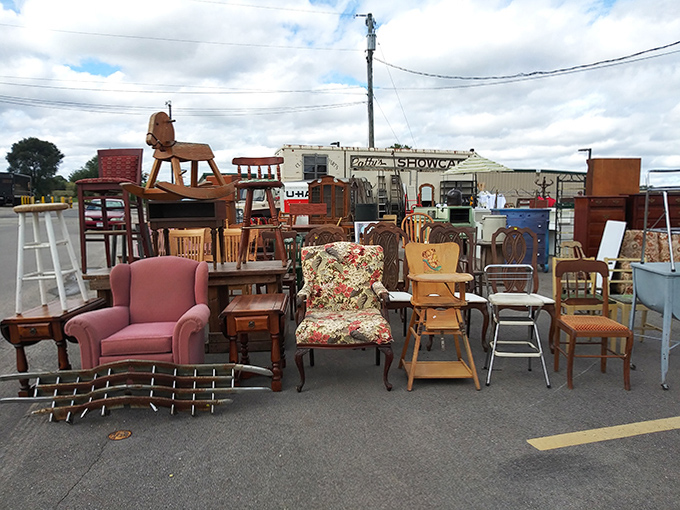The outdoor furniture display resembles a neighborhood block party where chairs from different decades have gathered to share their stories.
