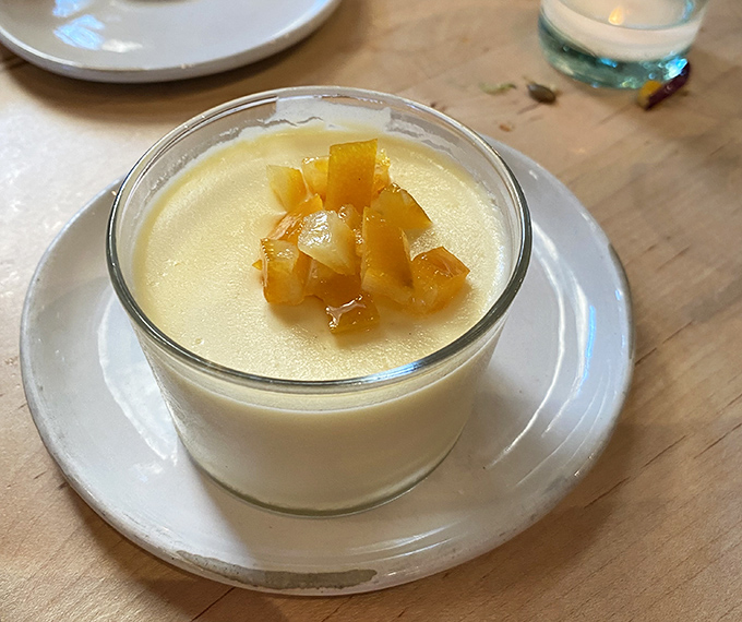 Panna cotta topped with fruit compote &ndash; silky, just-sweet-enough, and the perfect size to satisfy without overwhelming.