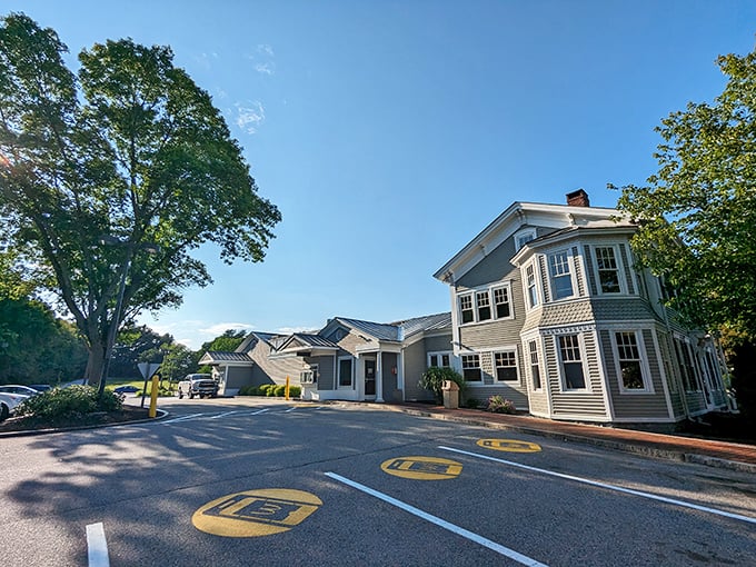 The parking lot maintains the property's dignified appearance &ndash; no garish signage to disrupt the historical aesthetic.