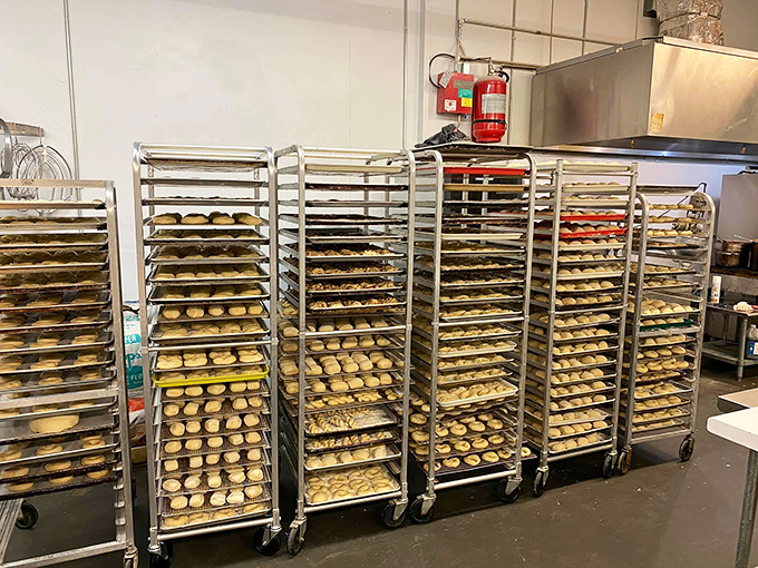 Behind-the-scenes magic! These racks of soon-to-be-baked treasures reveal the impressive scale of Madeleine's daily production.