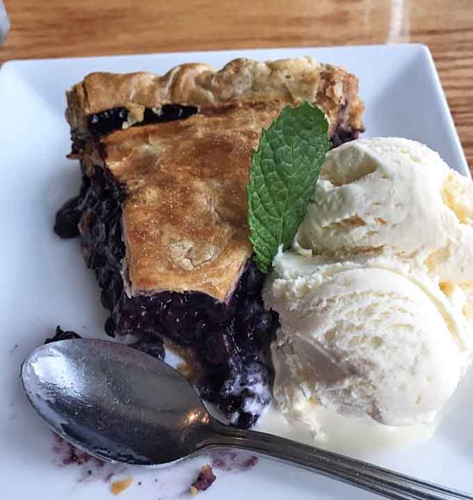 Warm blueberry pie topped with vanilla ice cream is the kind of dessert that makes you reconsider your life choices.