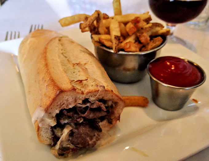 The Philly cheesesteak in its natural habitat &ndash; surrounded by hand-cut fries and anticipation, ready to ruin all other sandwiches for you.