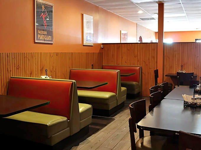 Comfortable booths and warm colors create the perfect setting for serious eating, with vintage Italian posters adding authentic charm.