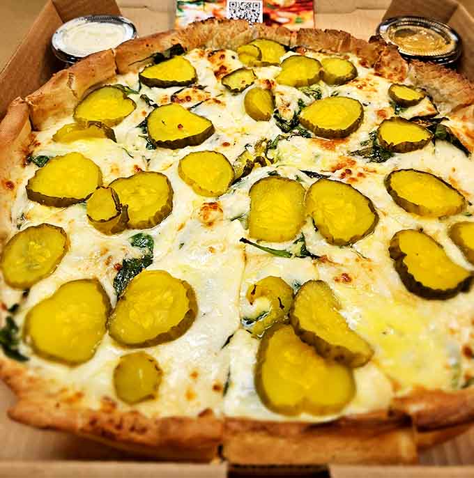 Yes, those are pickles on pizza, and yes, it's surprisingly delicious in that "why didn't anyone think of this sooner" kind of way.