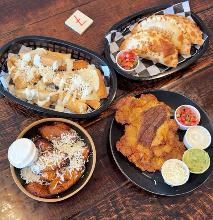 A spread of Latin-inspired dishes showcases the cafe's range, from crispy plantains to perfectly baked empanadas that demand your attention.