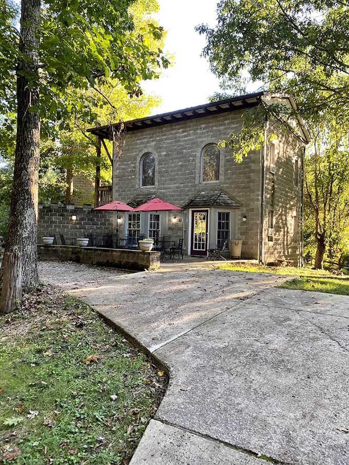 Stone walkways and careful landscaping create an atmosphere that feels transported from another time and place entirely.