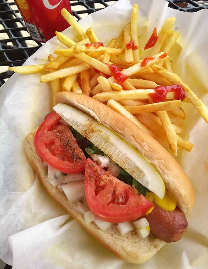 The classic Chicago-style hot dog with fries proves this place knows its way around more than just burgers.