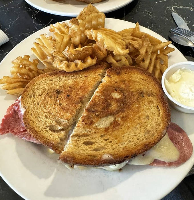 Grilled to golden perfection, this Reuben with waffle fries proves House of Flavors isn't just about the sweet stuff.