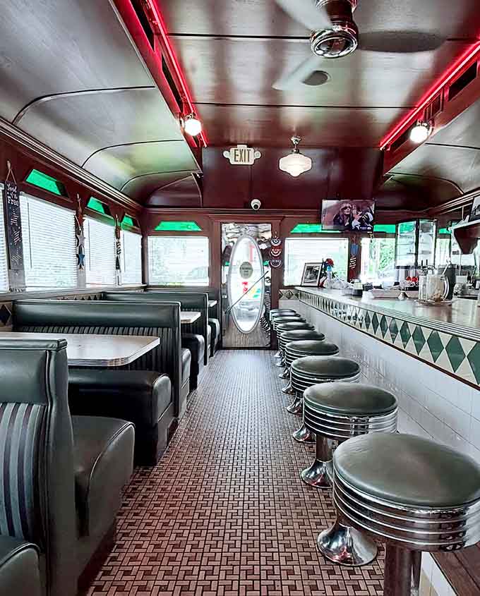 Booth seating where families gather, friends reconnect, and everyone agrees the 1950s had excellent taste in decor.
