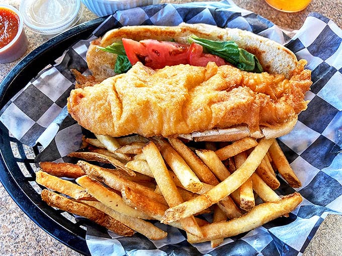 The fish in this fish and chips has the perfect golden crunch that shatters like glass, revealing tender white fish that tastes like a seaside vacation.