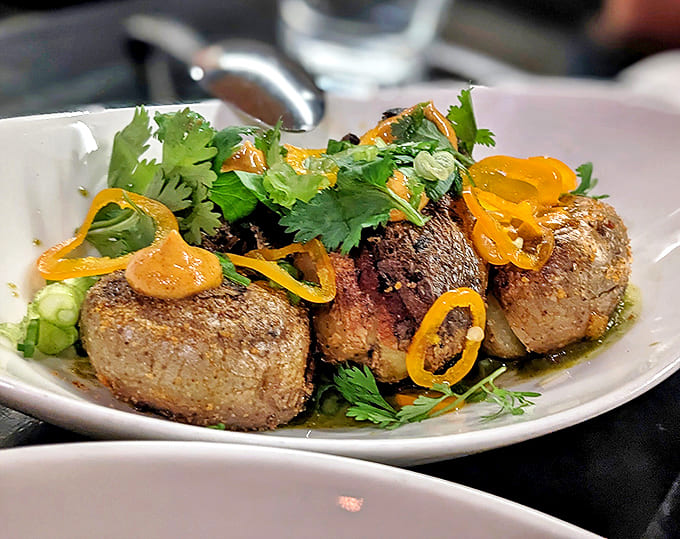 Roasted Mushrooms: Earthy mushrooms glisten with savory juices, their caramelized edges promising umami explosions. Comfort food that's had a sophisticated makeover.