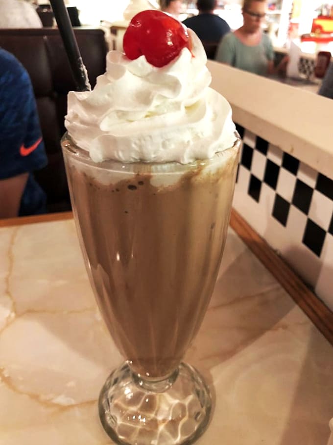 Thick, creamy, and topped with whipped cream and a cherry, this milkshake requires commitment and possibly a nap afterward.