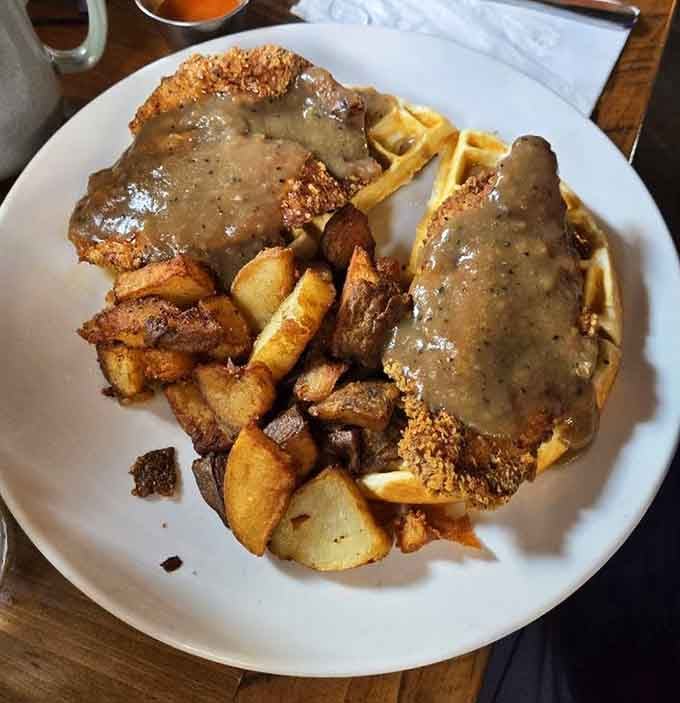 Crispy fried chicken meets fluffy waffles in this satisfying dish that proves Rowley Inn can handle multiple culinary traditions.