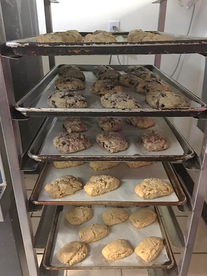 Fresh from the oven, these soon-to-be-legendary scones cool on racks, filling the bakery with an aroma that's better than any alarm clock.