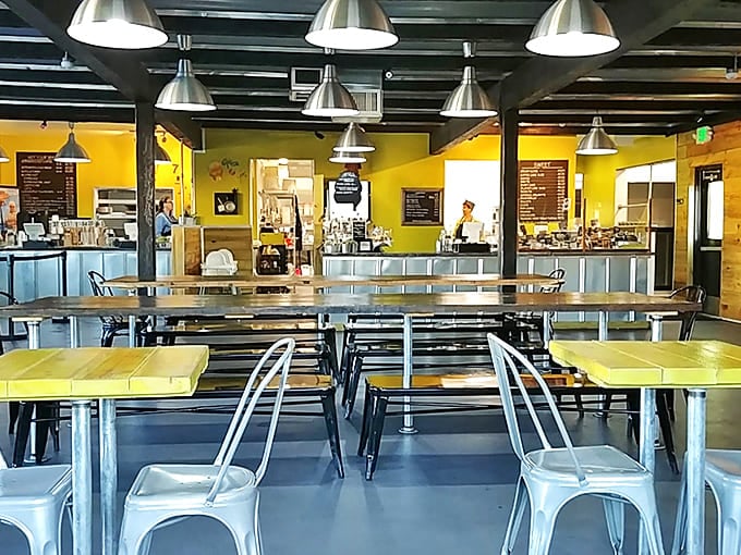 Metal chairs, wooden tables, and that signature yellow create a space that feels both contemporary and timeless &ndash; like comfort food itself.