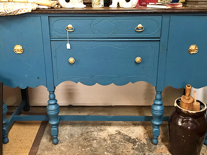 Sideboard: This blue beauty with scalloped edges and brass hardware isn't just furniture &ndash; it's a conversation piece with stories to tell.