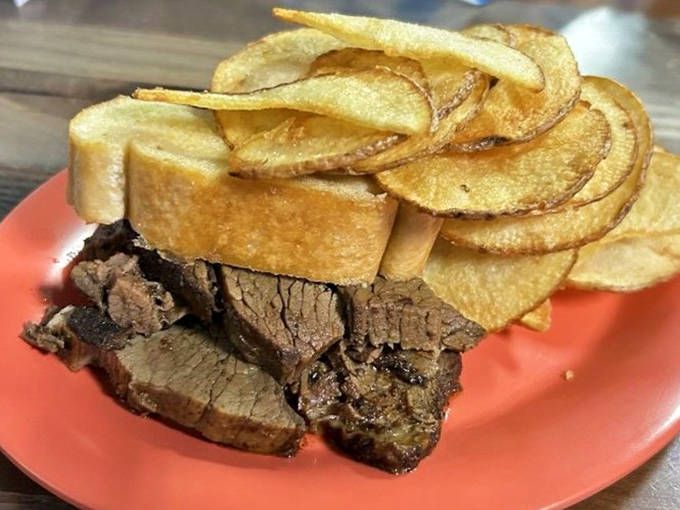 Brisket that's been smoking longer than some relationships last, served with house-made potato chips that shatter satisfyingly with each bite.