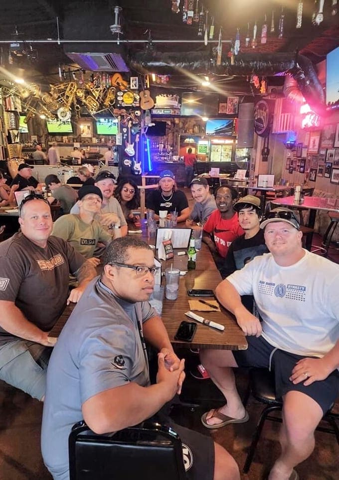The happy faces around this table tell you everything you need to know about the Smokey Jo's experience and its power to unite.