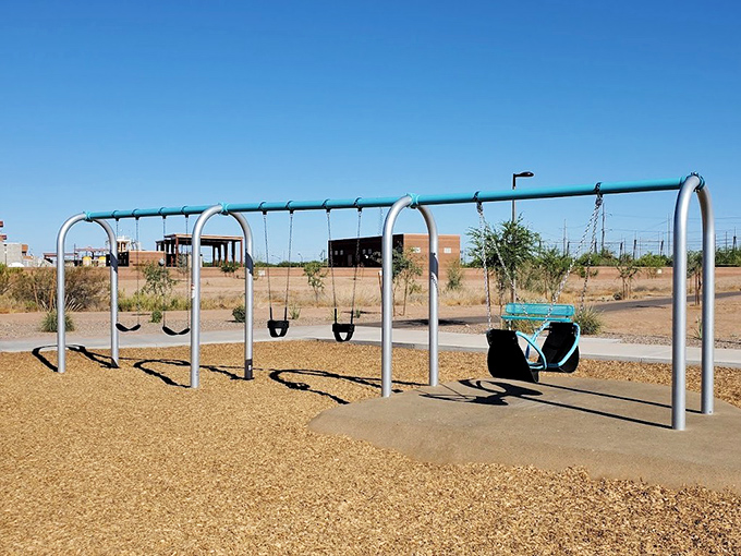 The swing set area provides classic playground fun with modern safety features &ndash; some childhood pleasures never need reinvention.