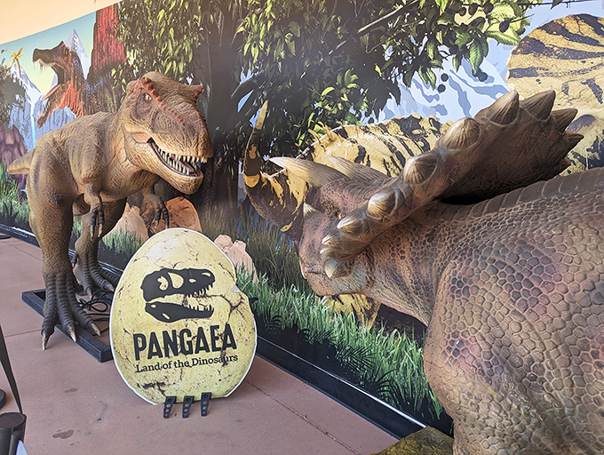 Ancient adversaries locked in eternal standoff. This dramatic T-Rex and Triceratops tableau captures the predator-prey relationships that shaped dinosaur evolution.