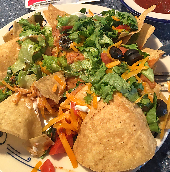 The taco salad arrives like a colorful supernova in a crispy tortilla bowl, fresh ingredients creating a flavor explosion with every bite.