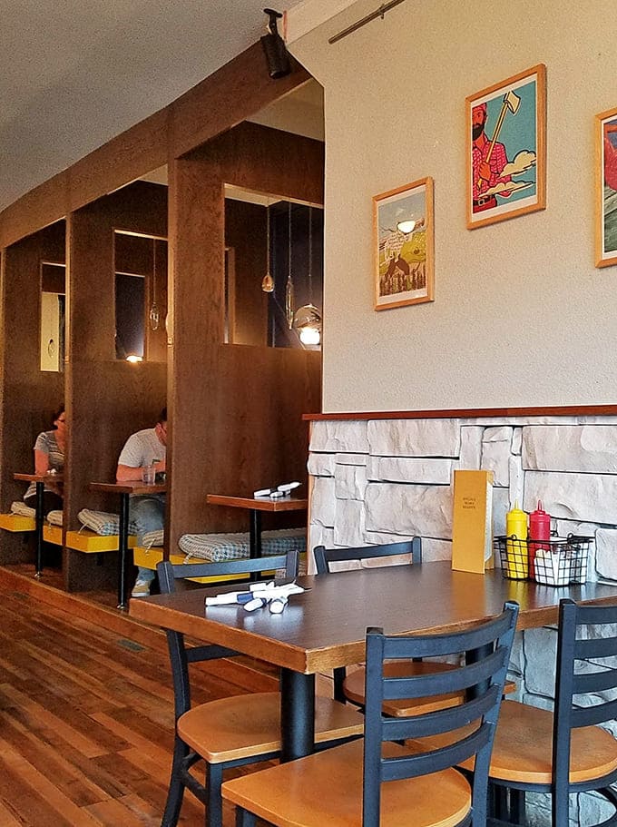 Cozy booth seating and thoughtful design details create intimate dining spaces perfect for lingering over good food and better conversation.