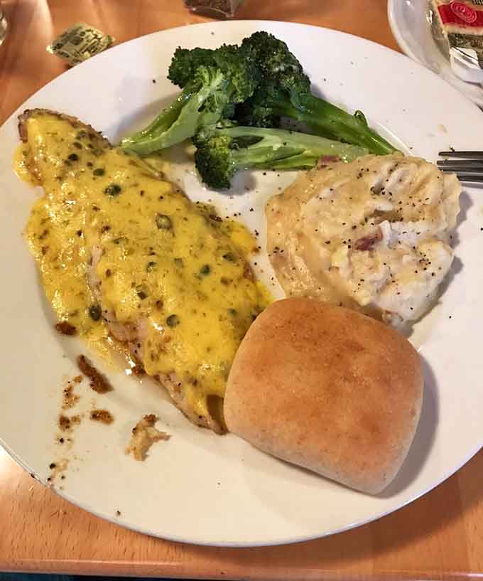 The wild walleye dinner showcases Minnesota's fishing heritage with perfectly cooked fish and classic sides.