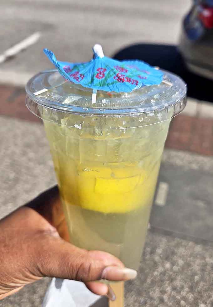 On hot summer days, fresh-squeezed lemonade with fruit boba pearls and a playful paper umbrella becomes liquid salvation between bites of pickle-perfect sandwiches.