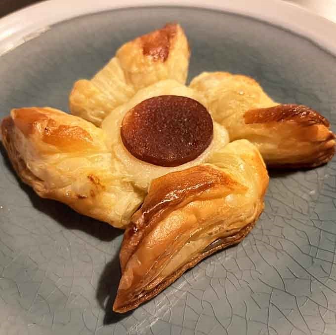 A Danish pastry that's basically a flower made of butter and dough, proving that breakfast can be both beautiful and delicious simultaneously.