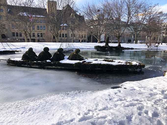 Winter transforms the park into a frosted wonderland where the topiaries look like they're wearing nature's own powdered sugar coating.