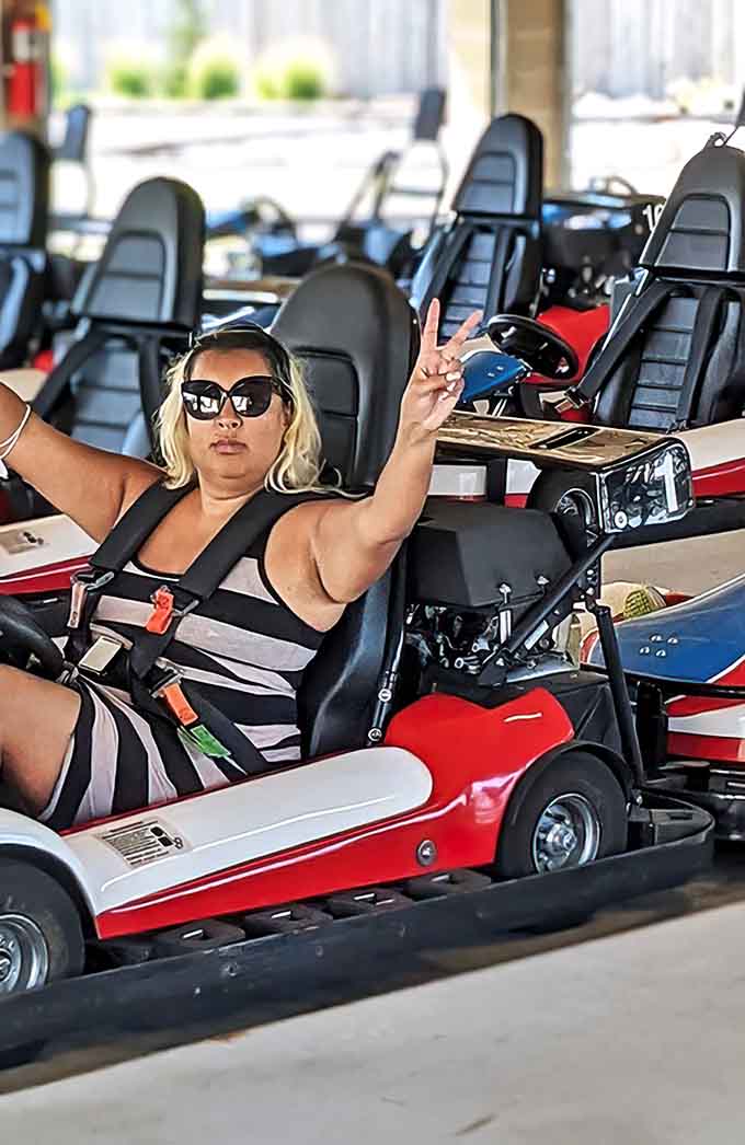 Victory poses come naturally when you're queen of the track, sunglasses optional but highly recommended for style points.