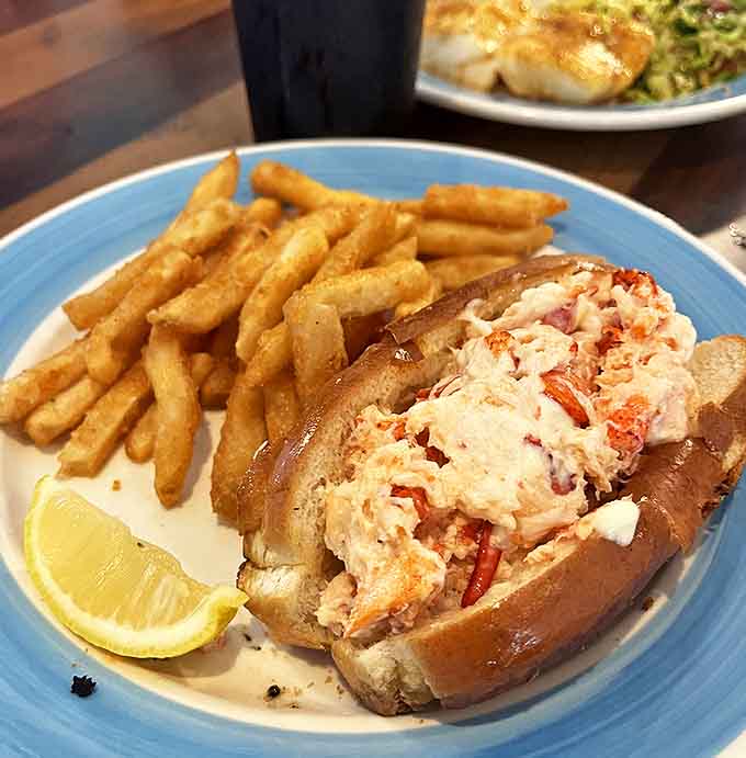 The classic New England lobster roll gets a Florida twist. Chunks of sweet lobster meat nestled in a buttery roll with a side of crispy fries is vacation on a plate.