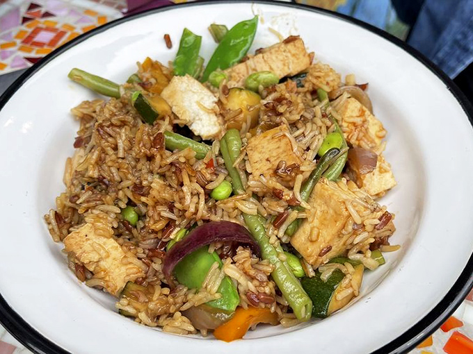 A colorful medley of vegetables and perfectly seasoned tofu proves that kosher cuisine extends far beyond traditional boundaries into delicious global territory.